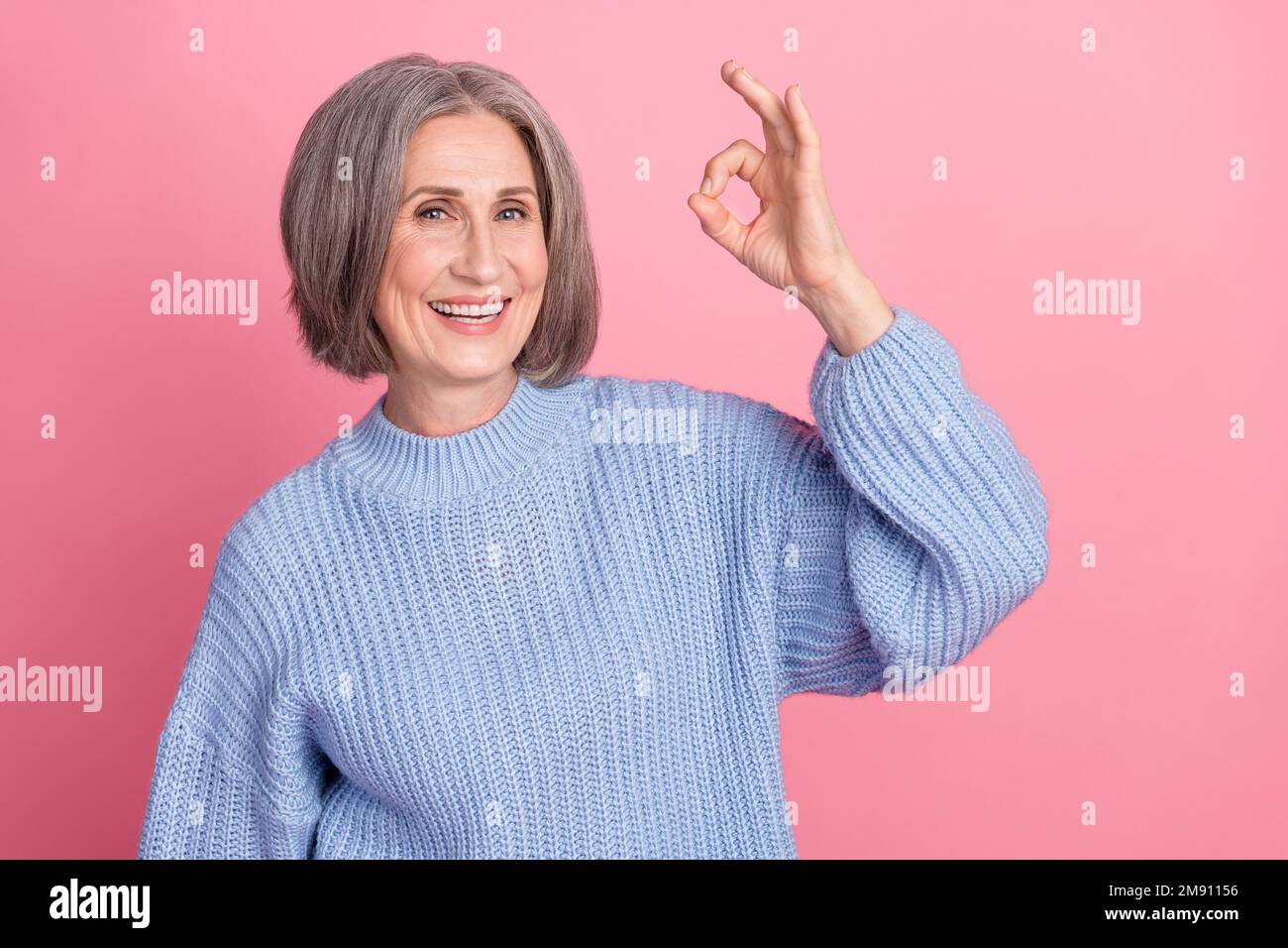 Photo of adorable positive lady wear cozy stylish clothes arm okey ...