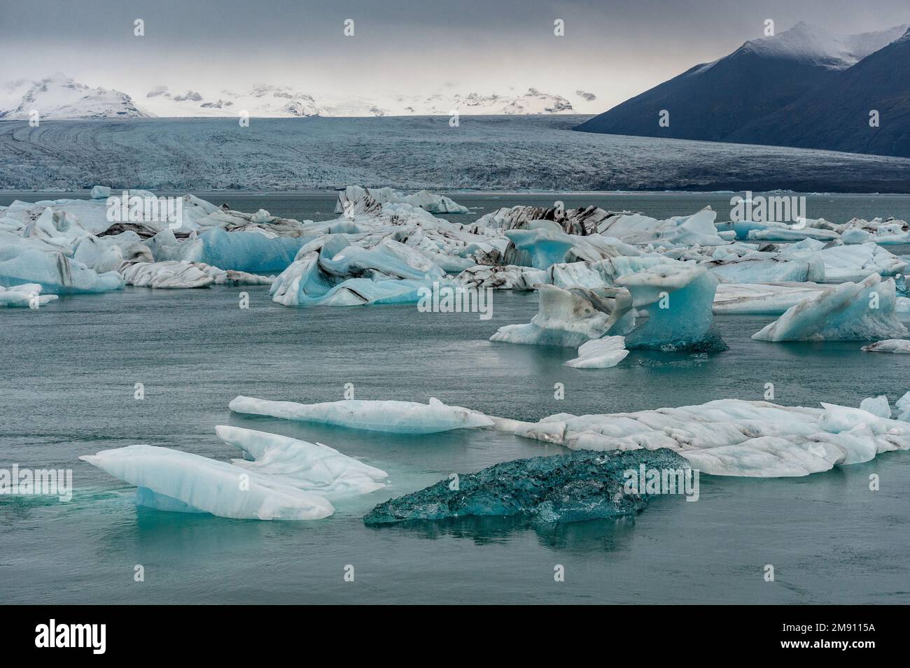 Jokulsarlon Glacier Lagoon in Iceland. Cloudy Sky, Floe and Iceberg in ...