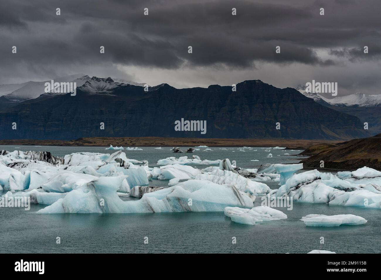 Jokulsarlon Glacier Lagoon in Iceland. Cloudy Sky, Floe and Iceberg in ...