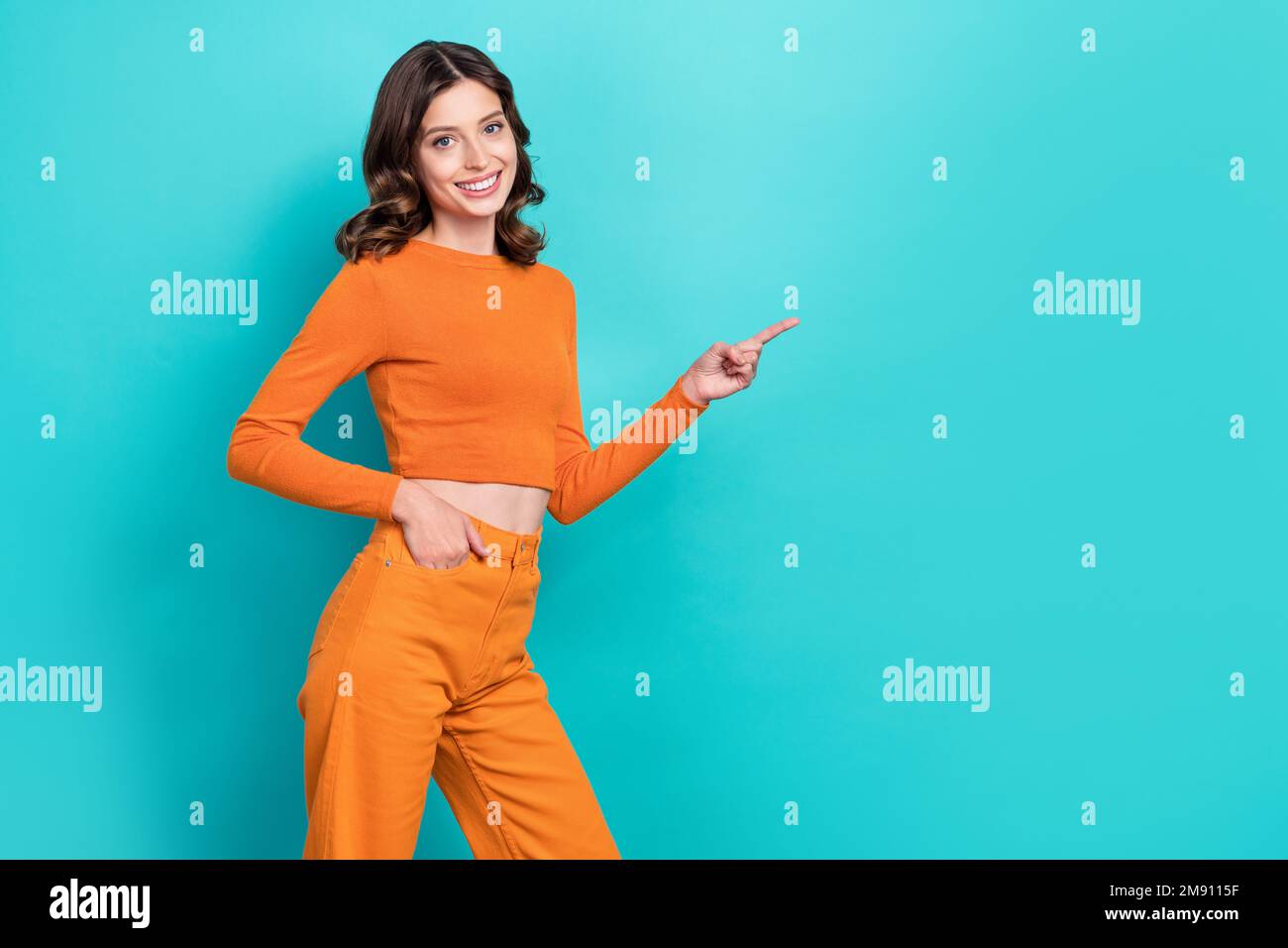 Photo portrait of cute young lady confident point empty space hold arm ...
