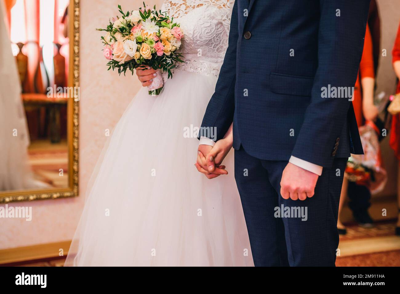 bride and groom holding hands together at the wedding ceremony Stock ...