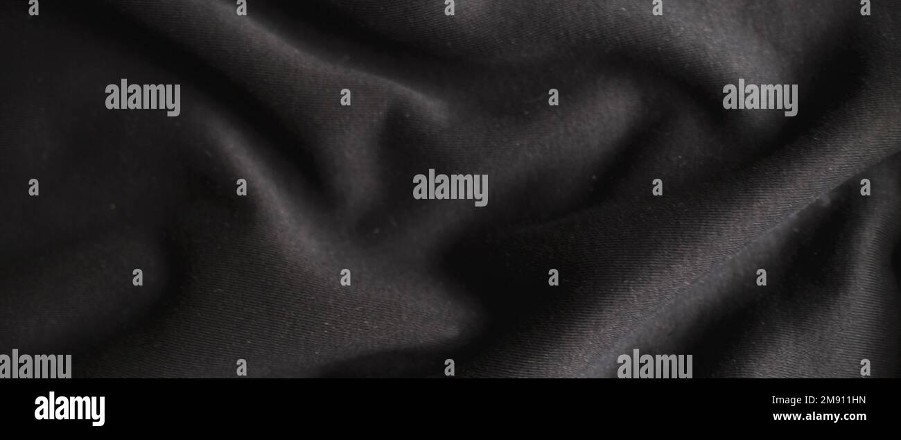 black wrinkled plush fabric background texture, soft material pattern ...