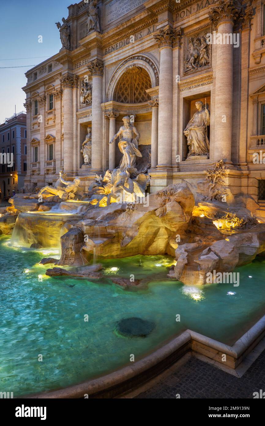Evening at the Trevi Fountain in city of Rome, Italy. Baroque style ...