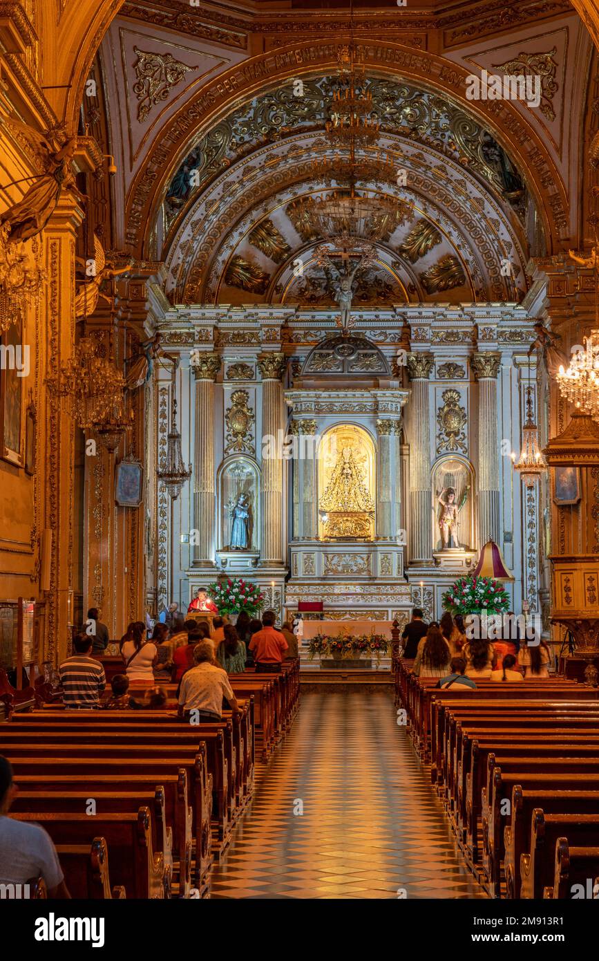 A priest conducts a mass in the Basilica of Our Lady of Solitude, part ...