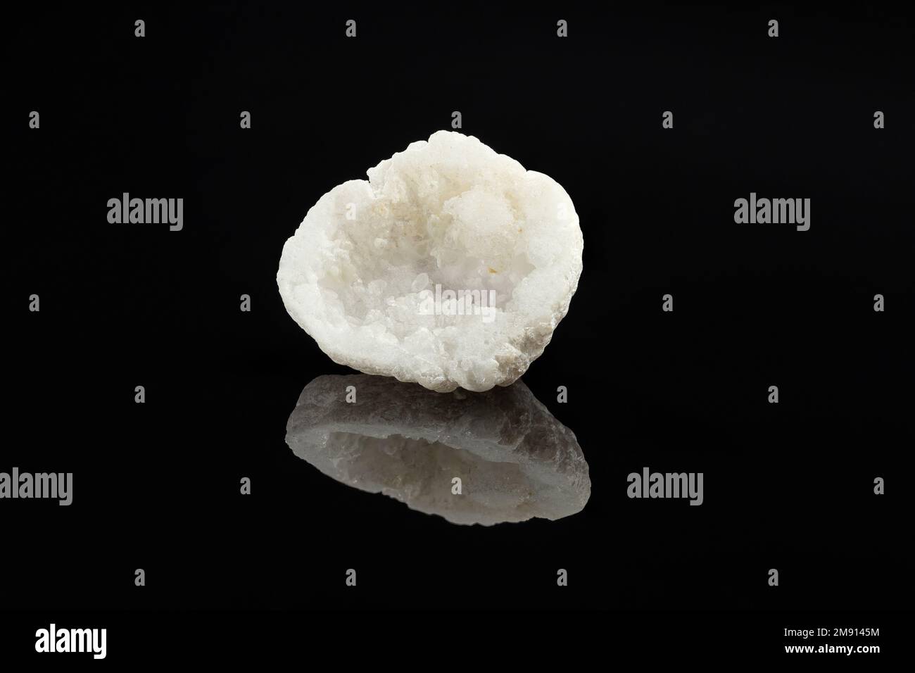 White Raw Apatite Crystal Geode with Crystalline Close Up on Black ...