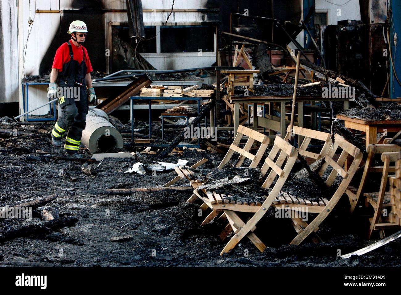 A rescue commander inside a building after a fire Stock Photo - Alamy