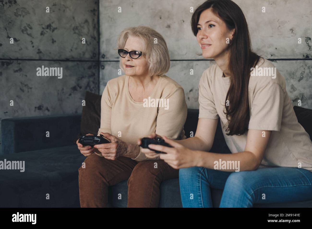Retired woman enjoying playing and competition game online together on ...