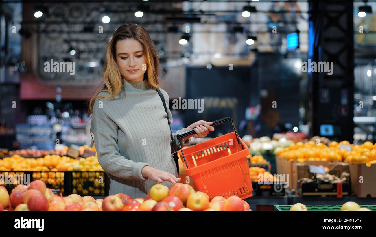 Young business woman girl buyer client blonde lady consumer stands in ...