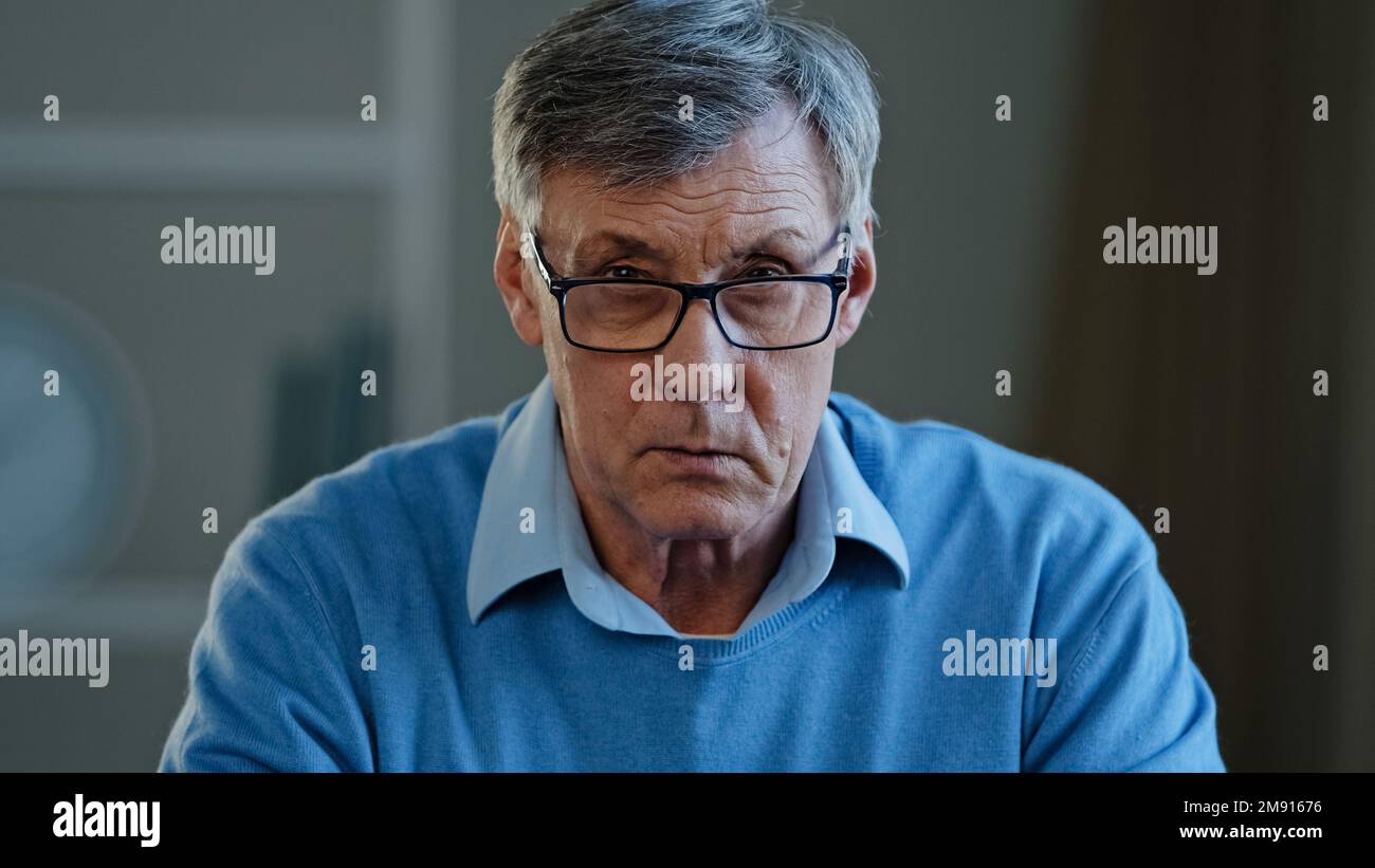 Close up shocked wrinkled male face old Caucasian businessman feeling ...