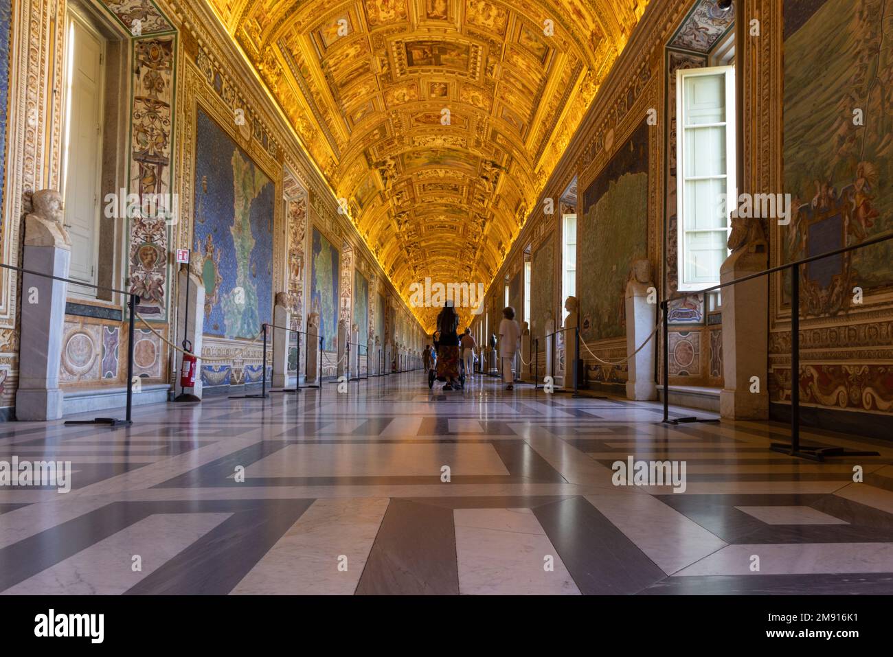 Vatican city museum. Gallery of maps. Hall with marble floor and gold ...