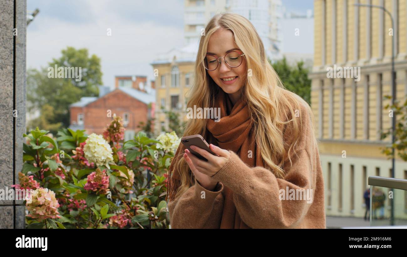 Woman scrolling phone hi-res stock photography and images - Alamy