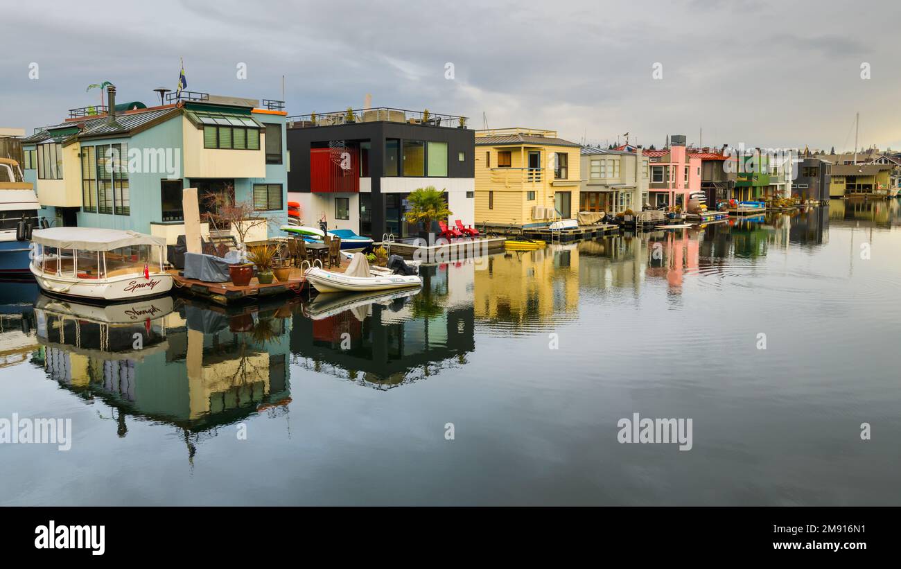 Seattle, WA, USA - January 15, 2023; Moody view of houseboat reflection ...