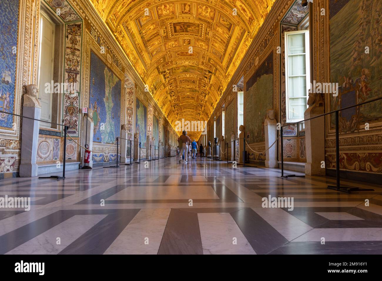 Vatican city museum. Gallery of maps. Hall with marble floor and gold ...