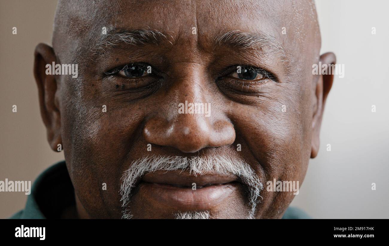 Close up African American male face with wrinkles and gray beard ...