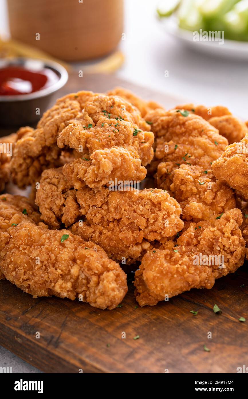Fried chicken tenders or strips with sauces and fries Stock Photo - Alamy