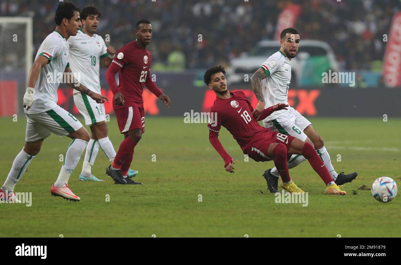 Qatar's Khalid Muneer, center, fights for the ball , during the Arabian ...