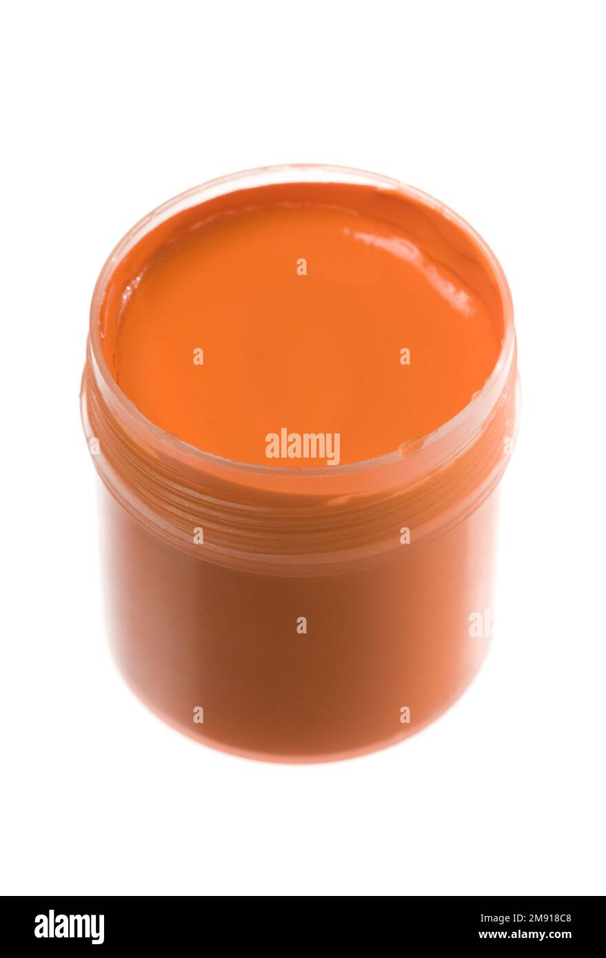 Orange gouache paint in a jar on white Stock Photo - Alamy