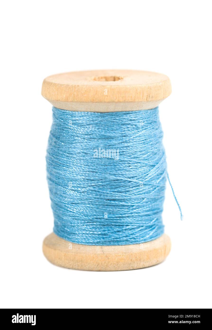 Old wooden reel of thread on white Stock Photo - Alamy