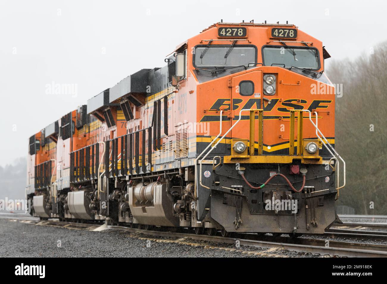 Seattle, WA, USA - January 15, 2023; BNSF freight locomotive standing in the rain on a damp day ...