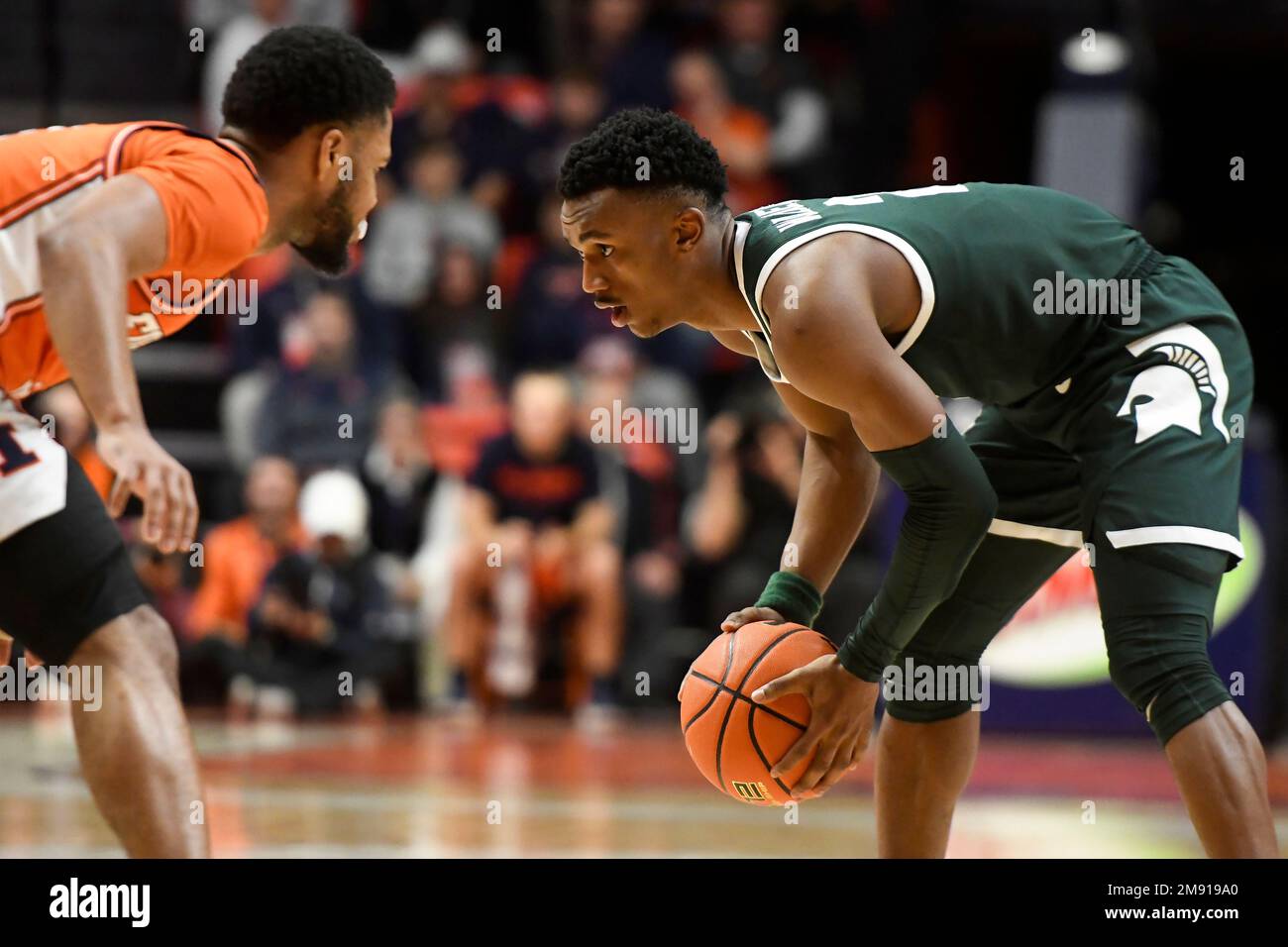 Michigan State's Tyson Walker, right, eyes Illinois' Jayden Epps, left ...