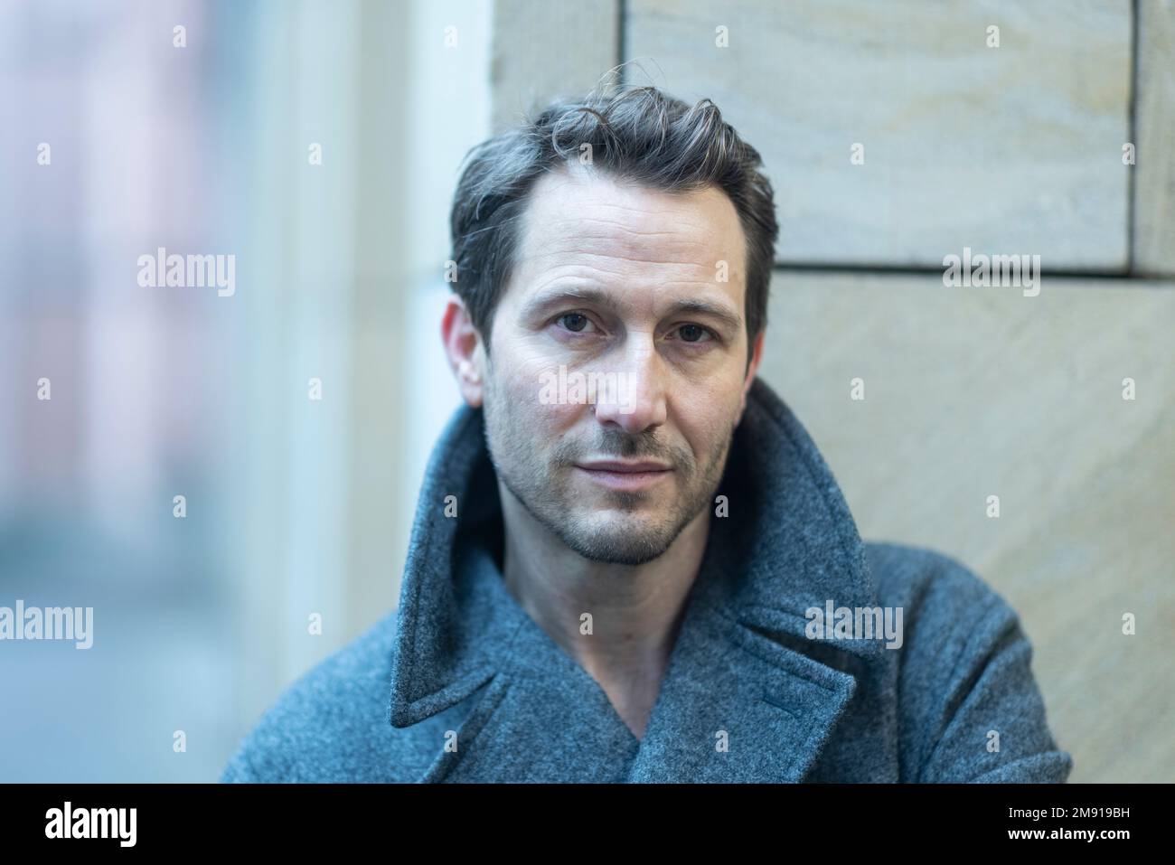 PRODUCTION - 16 January 2023, Hessen, Frankfurt/Main: Actor David Rott ...