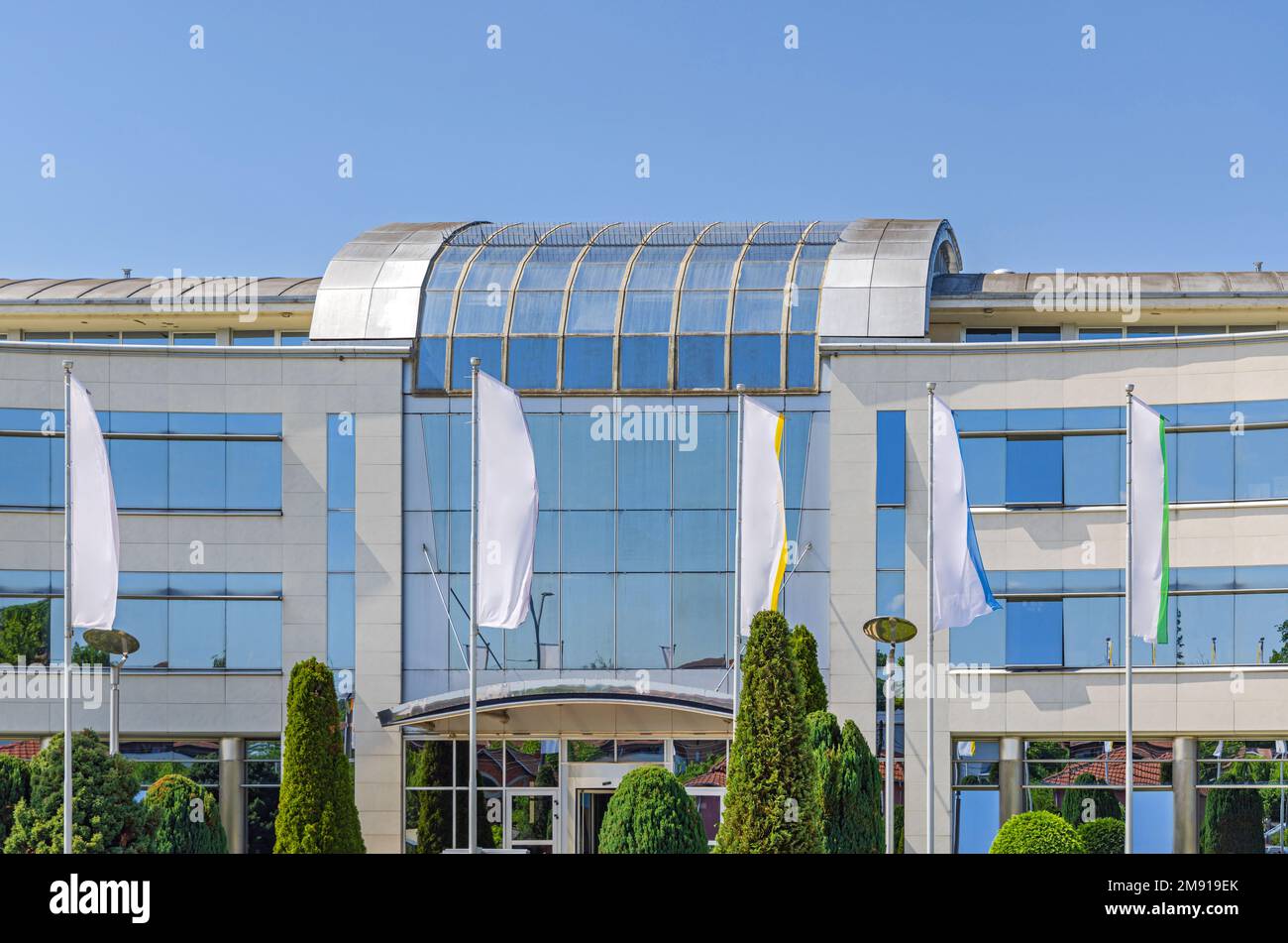 White Flags in Front of Modern Office Building Company Headquarters ...