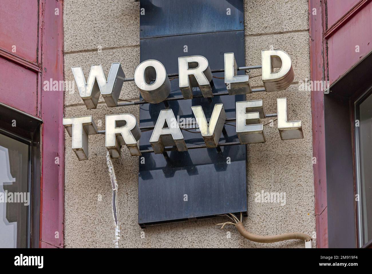 3d White Sign World Travel at Building Exterior Stock Photo - Alamy