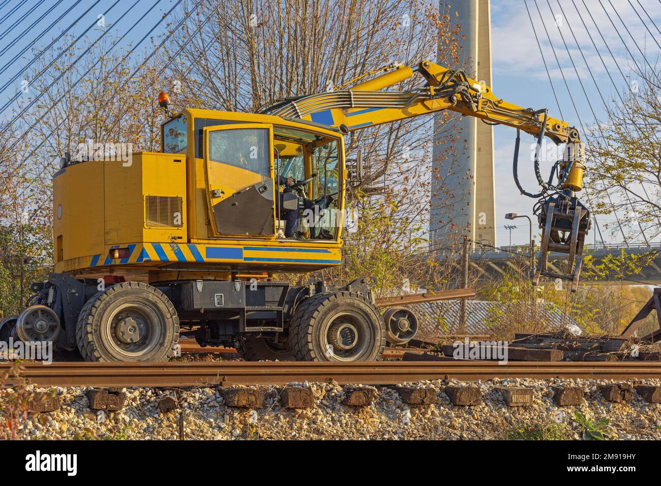 Grappling Forks Digger Machine at Old Railroad Tracks Stock Photo - Alamy
