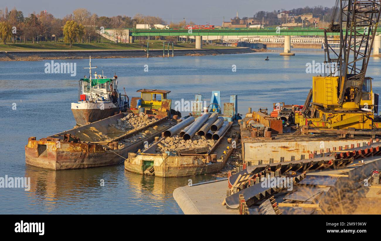 Old Barges Loaded With Construction Material Debris and Pipes at River ...