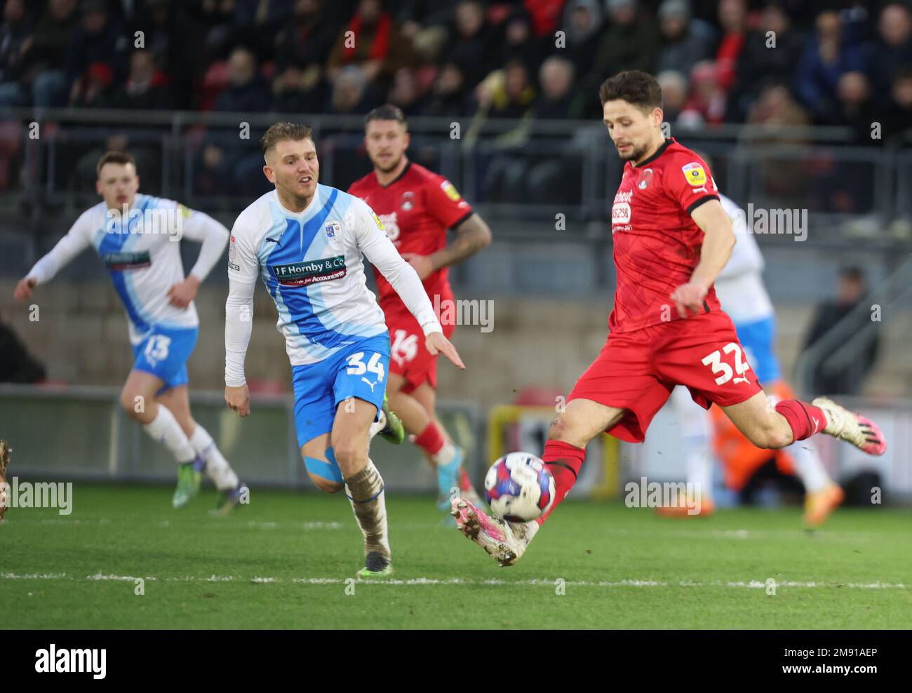 L-R Ben Whitfield of Barrow and Rob Hunt of Leyton Orient during League ...