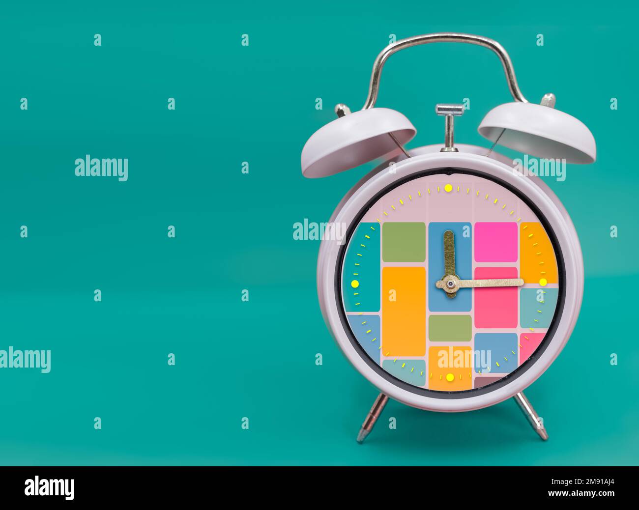 Ringing twin bell vintage classic alarm clock Isolated on blueand with ...