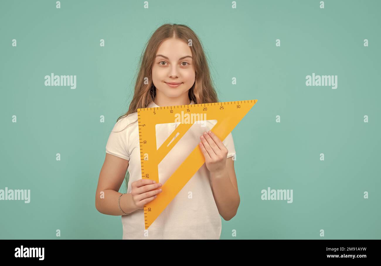 smiling child with math triangle measuring tool Stock Photo - Alamy