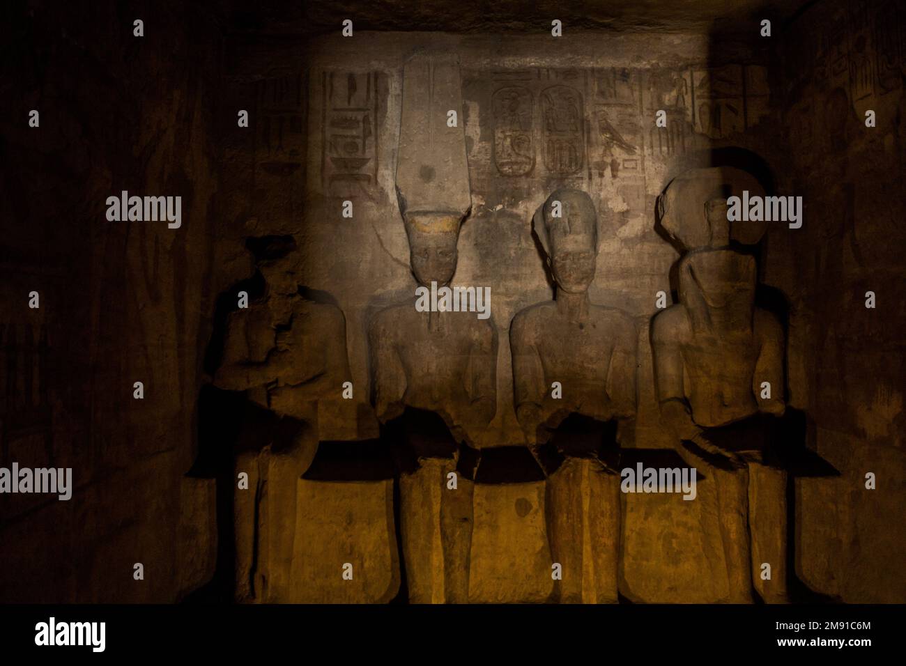 Statues of Ptah, Amun Ra, king Ramesses II and Ra-Horakhty illuminated ...