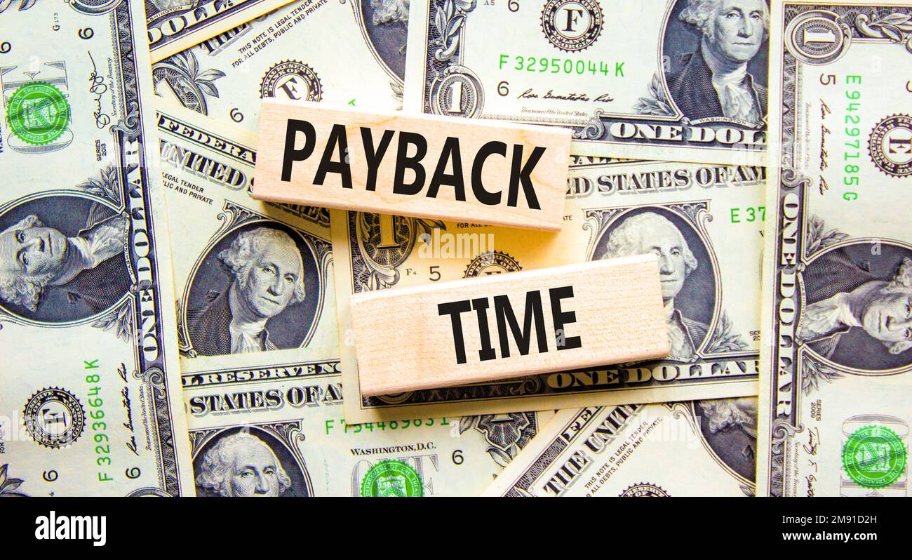 Payback time symbol. Concept words Payback time on wooden blocks ...