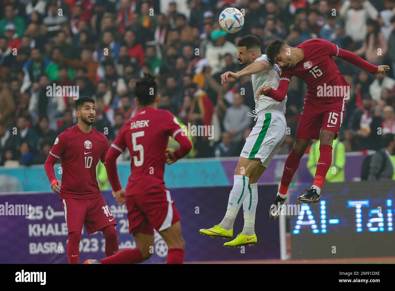 Iraq's Ayman Hussein, center, fights for the ball during the Arabian ...