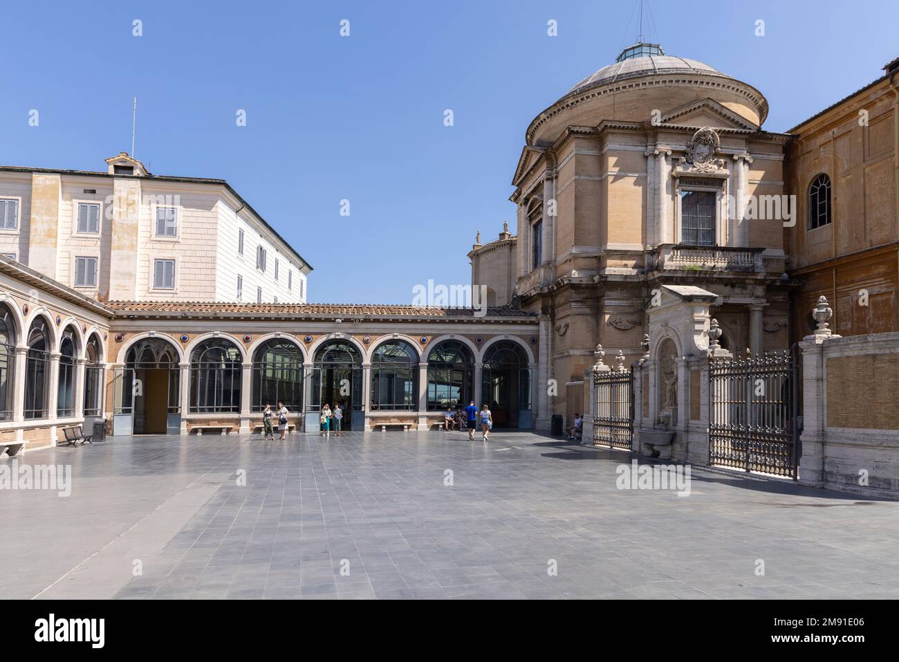Inner courtyard of Vatican city museum with visitors. Exterior of ...