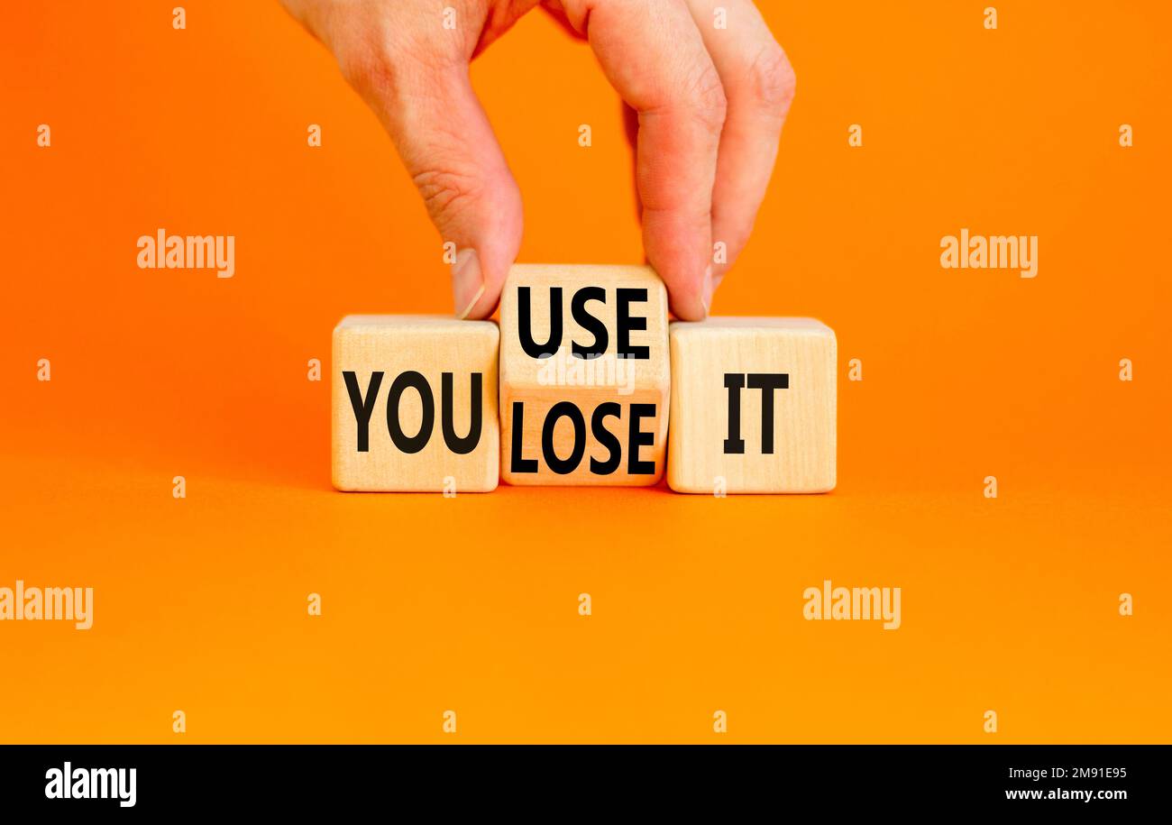 You use or lose it symbol. Concept word You use or lose it on wooden ...