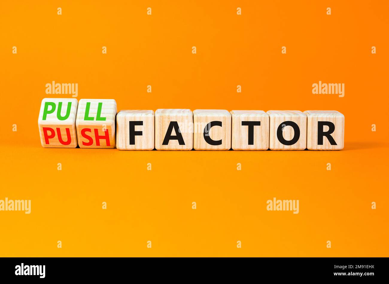 Pull or push factor symbol. Concept word Pull factor and Push factor on wooden cubes. Beautiful ...