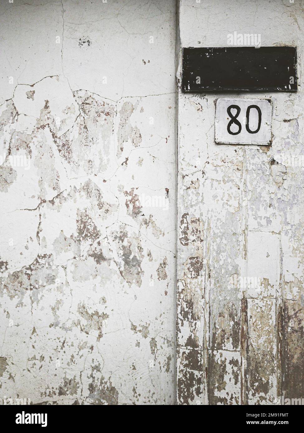 old house address number plates on grungy white wall Stock Photo - Alamy