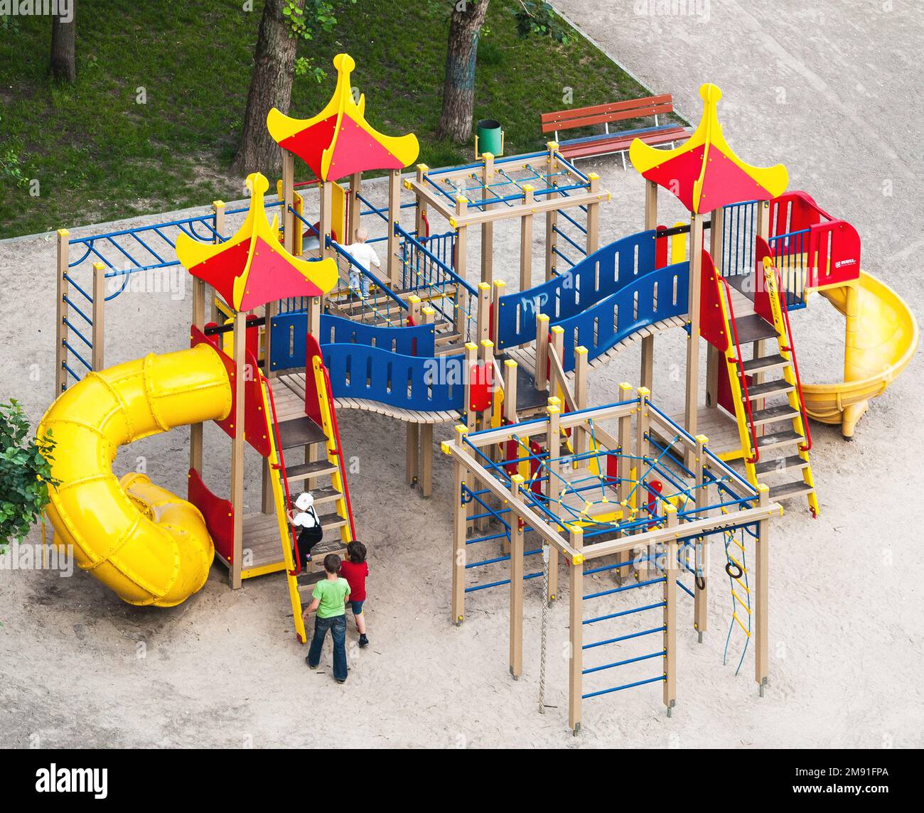 children plays at the compact playground complex facility Stock Photo ...