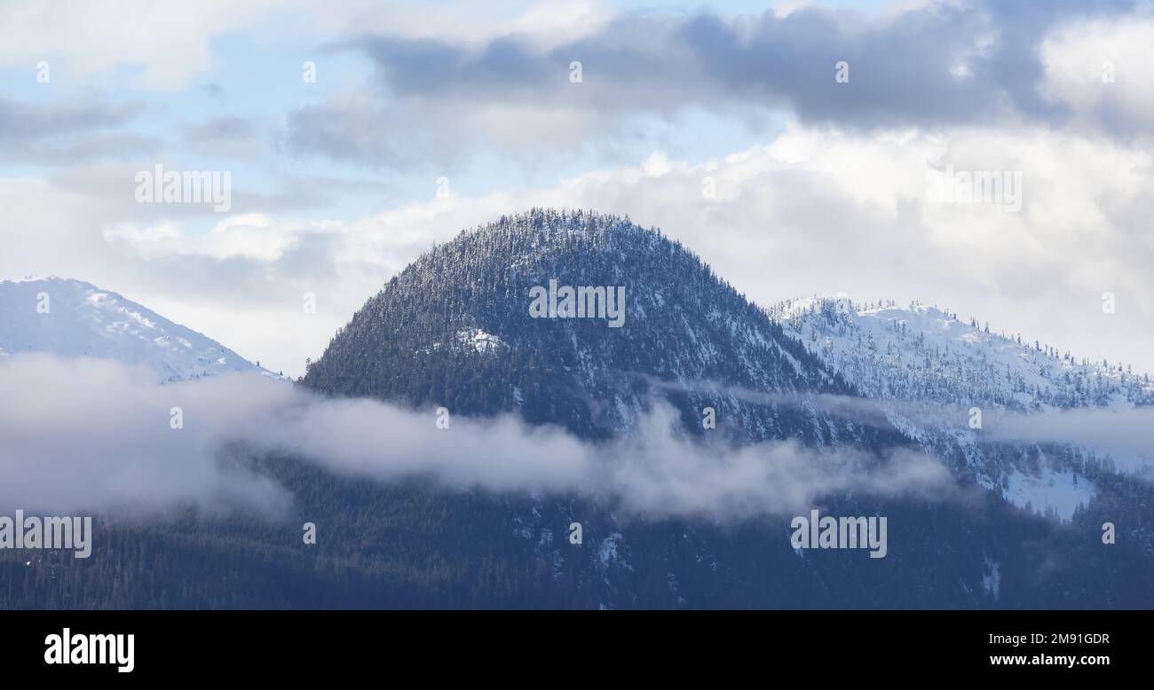Snow and Cloud covered Canadian Nature Landscape Background Stock Photo ...