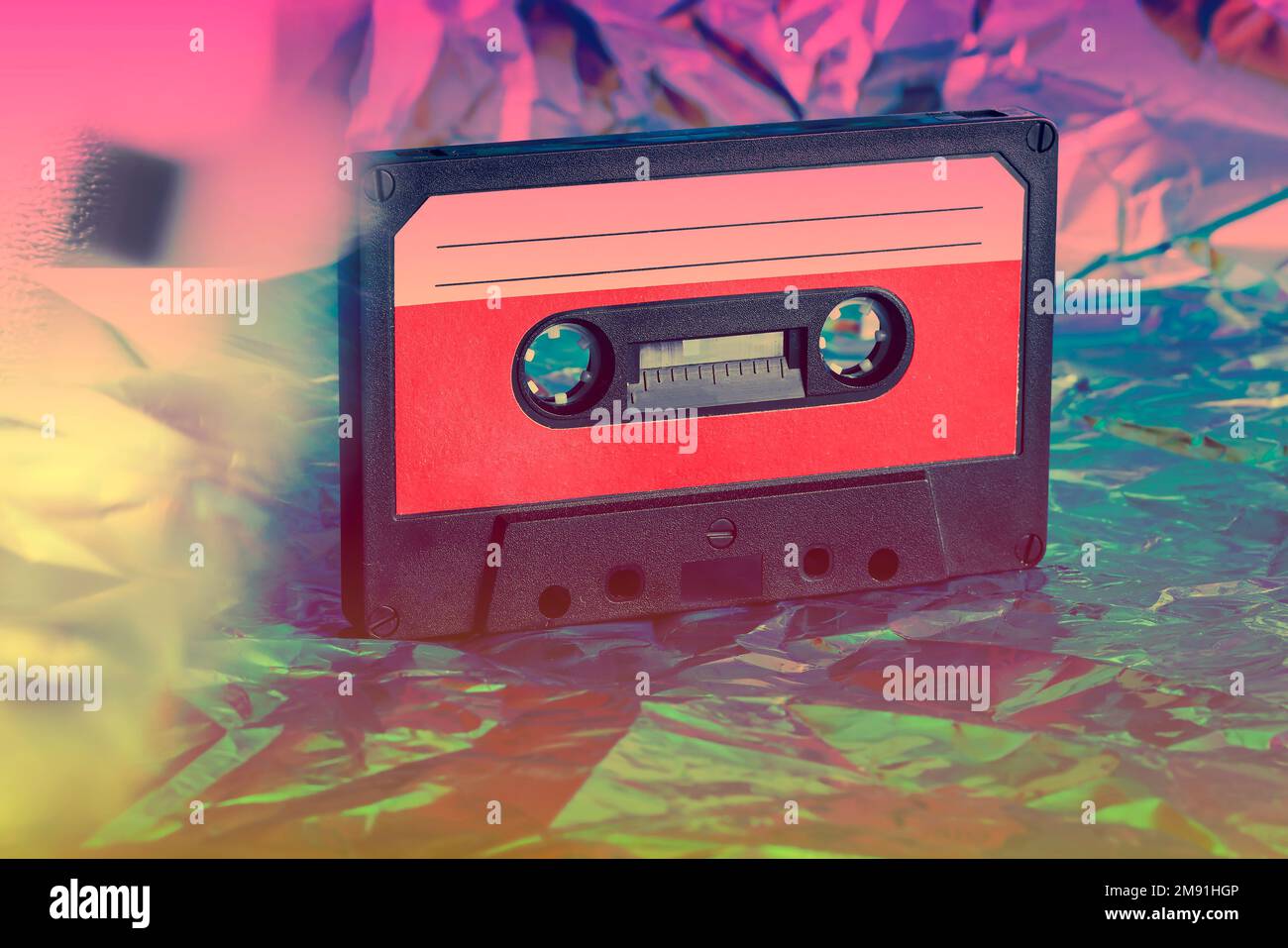 old cassette tape on crumpled neon background. retro and nostalgia ...