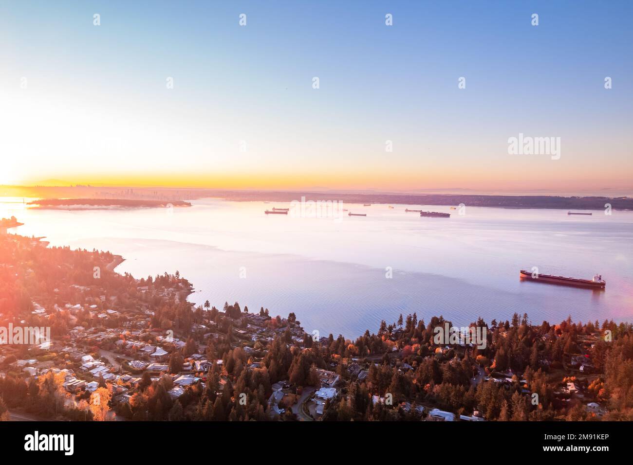 Aerial view of West Vancouver and Vancouver, sunrise ocean cityscape ...