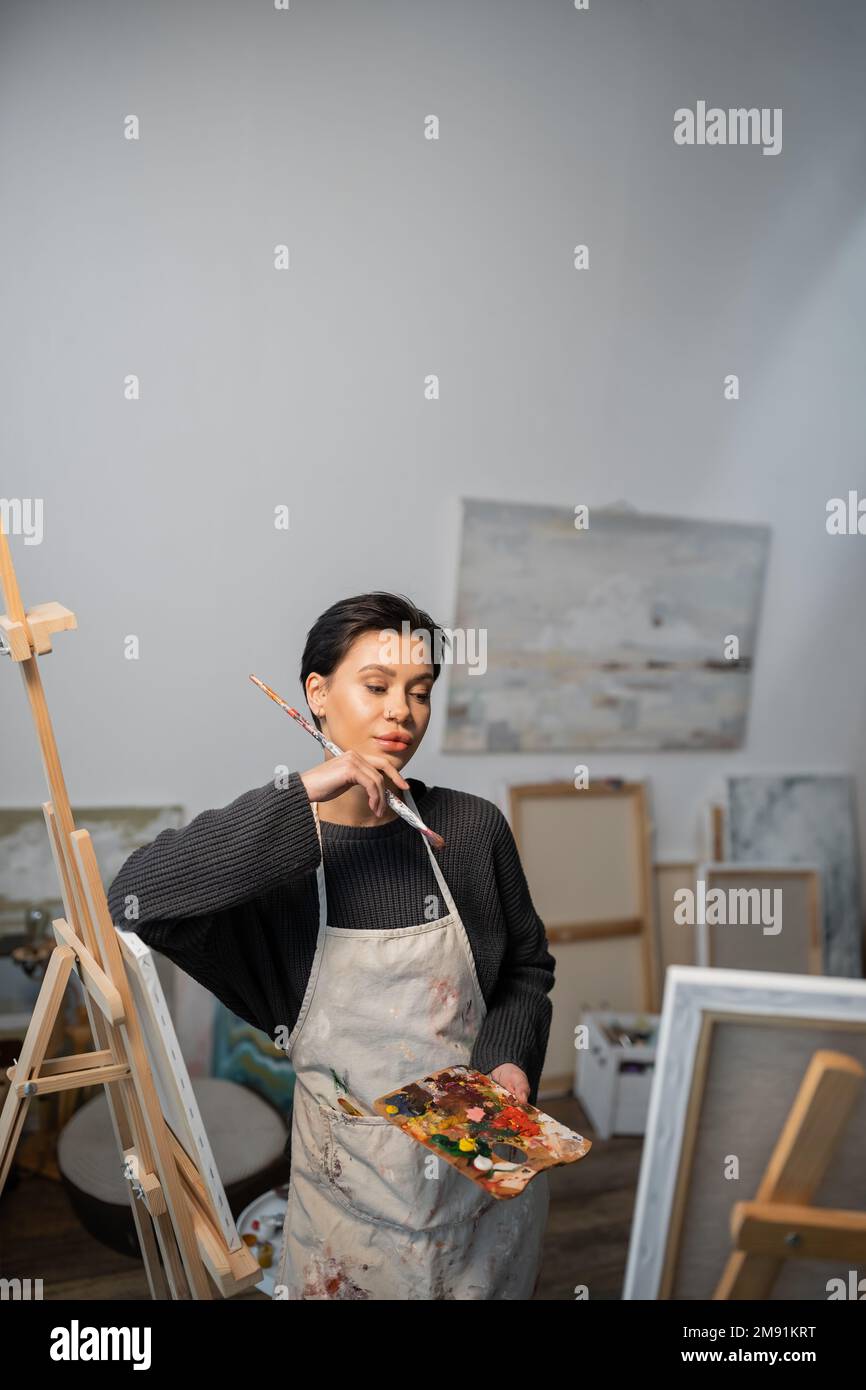 Focused woman artist paints hi-res stock photography and images - Alamy