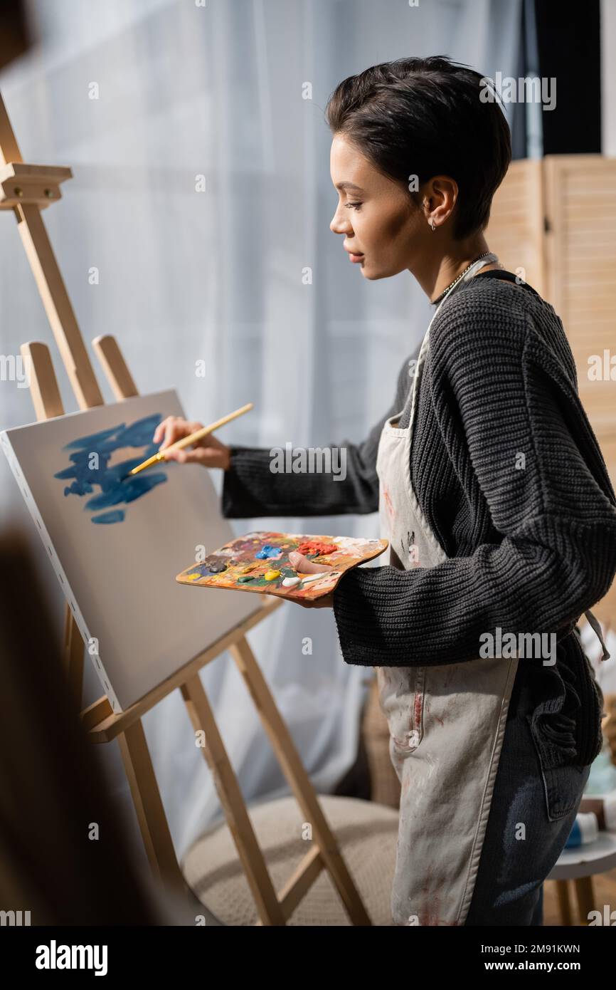 Side profile young woman painting hi-res stock photography and images ...