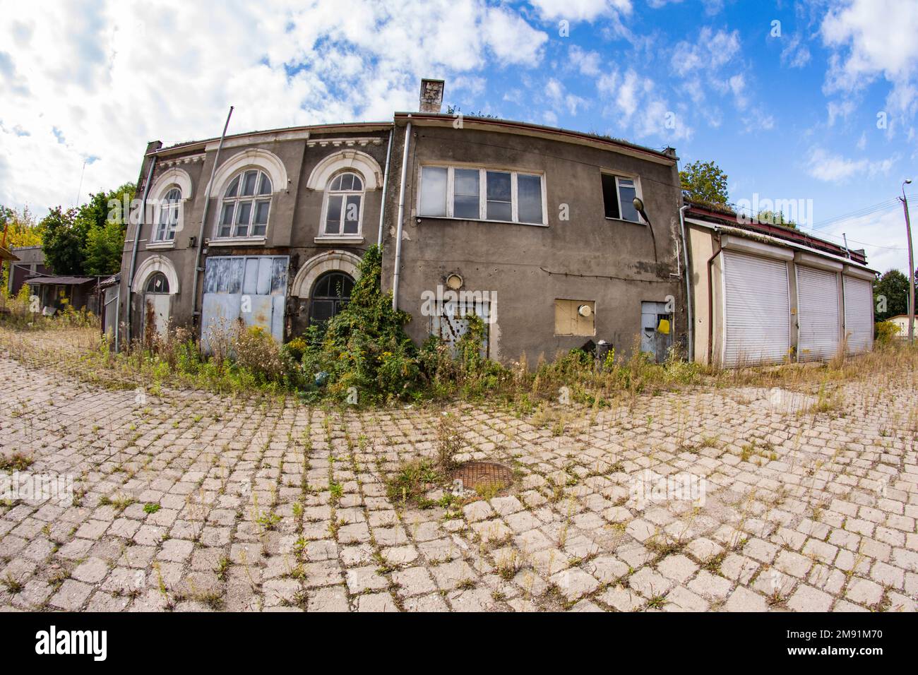 Abandoned and neglected building under a blue sky on a sunny day Stock ...