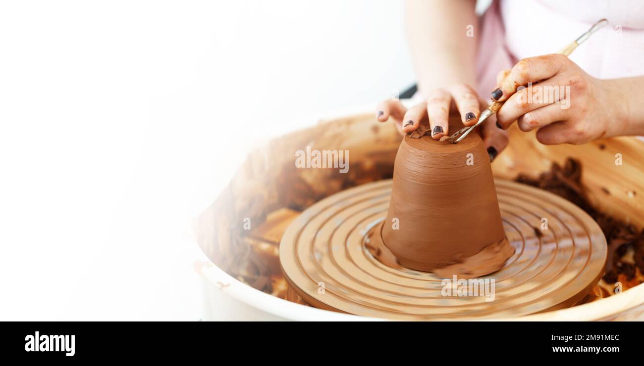 Female hands hold a bowl for casting clay products. Shaped method for ...