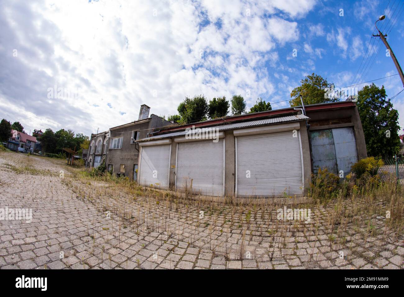Abandoned and neglected building under a blue sky on a sunny day Stock ...