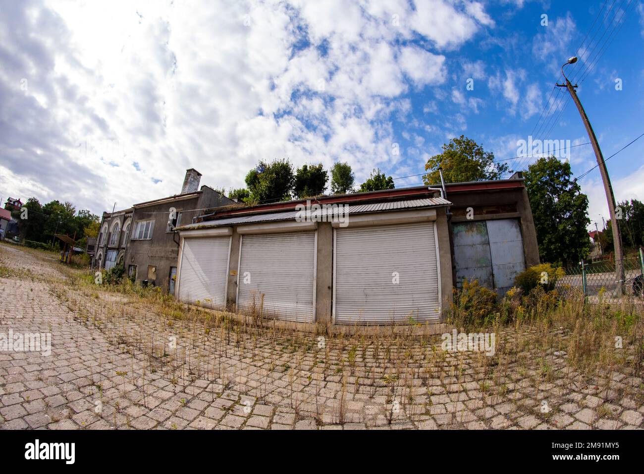 Abandoned and neglected building under a blue sky on a sunny day Stock ...