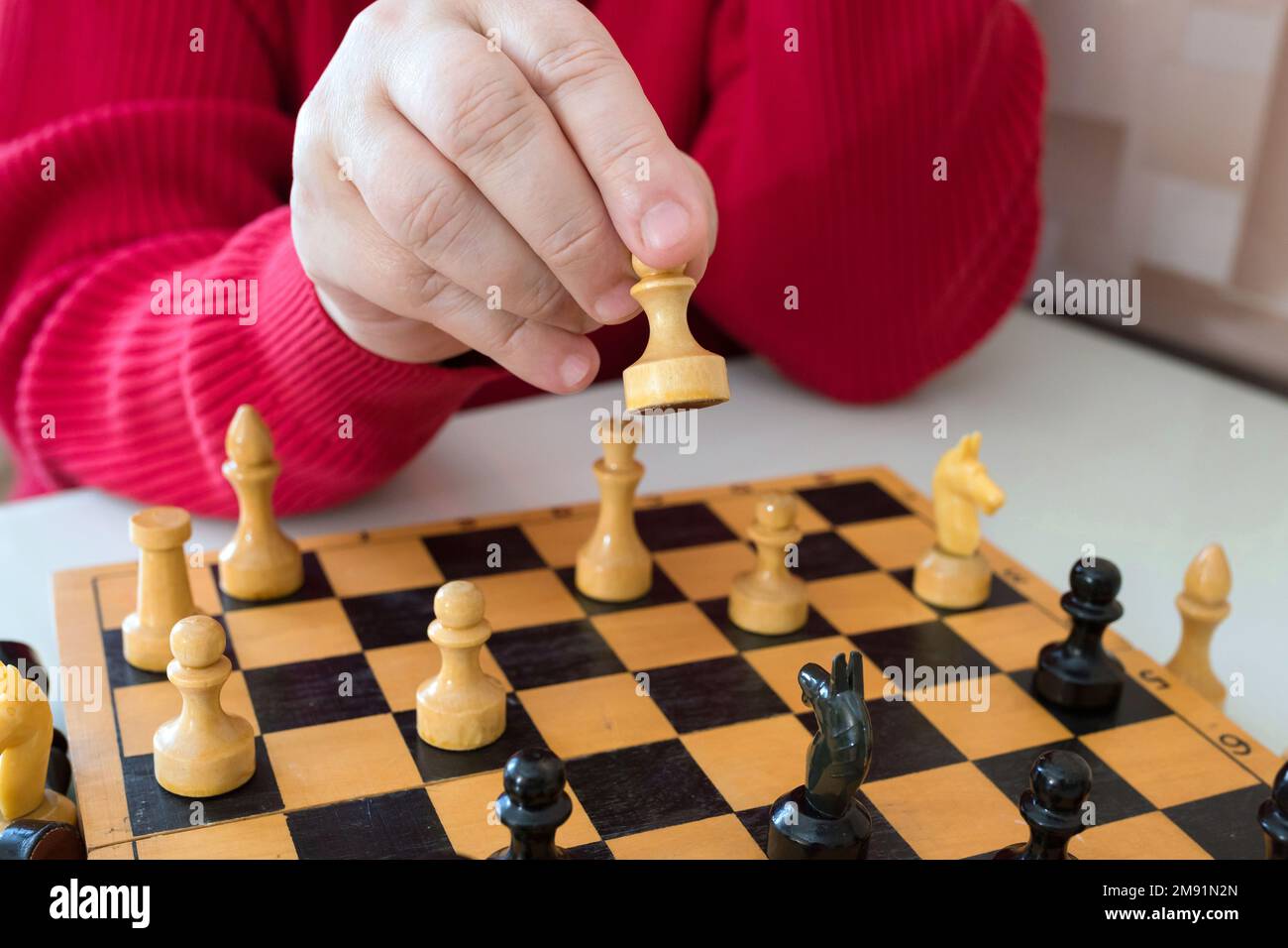A close-up of a man's hand and chess. Sports and games Stock Photo - Alamy